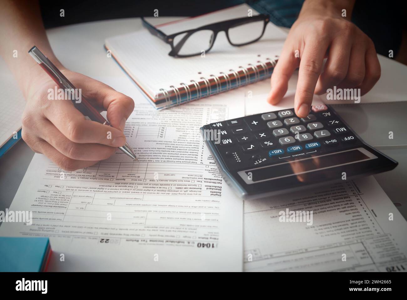 Tax time, tax concept with man filling tax form. Business income Stock ...