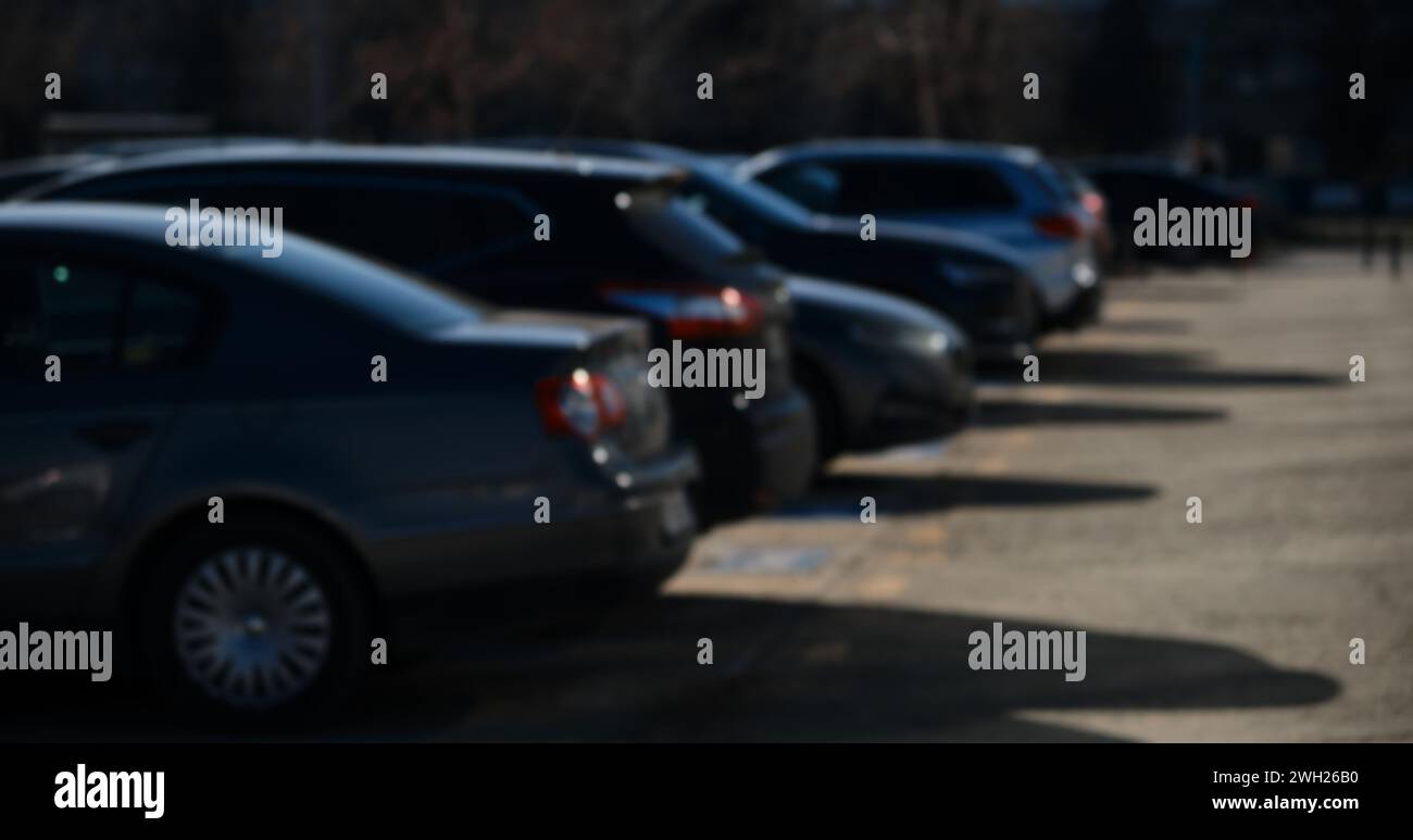 The cars are parked in a special paved parking lot, hardly standing ...