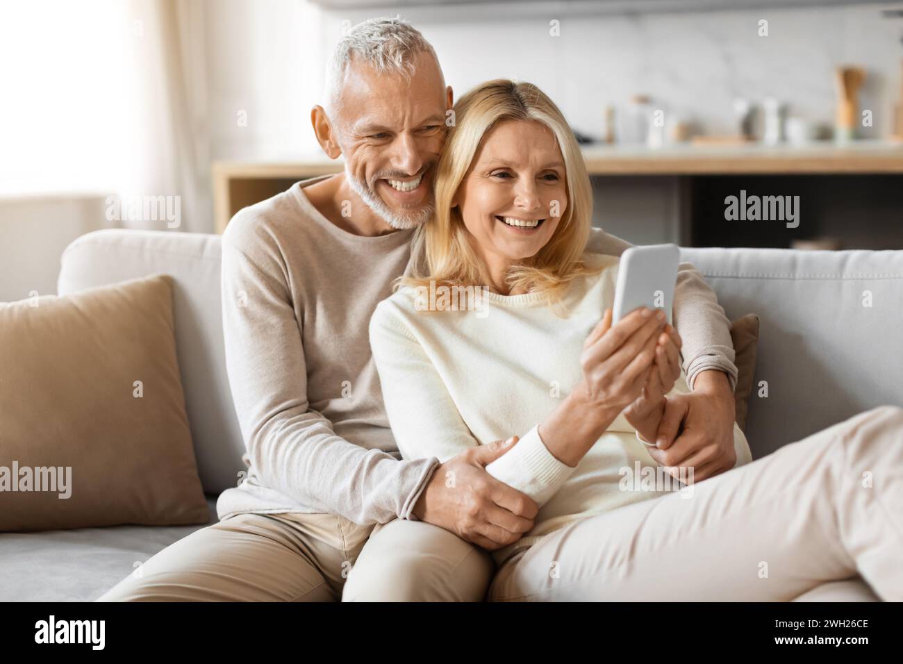 Man home happily scrolling hi-res stock photography and images - Alamy