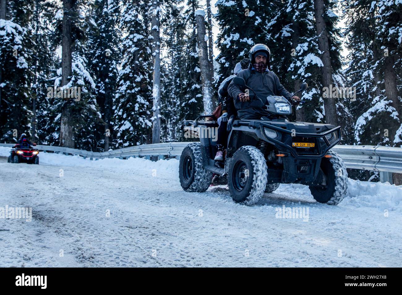 Srinagar, India. 07th Feb, 2024. Indian tourists enjoy snow scooter ...