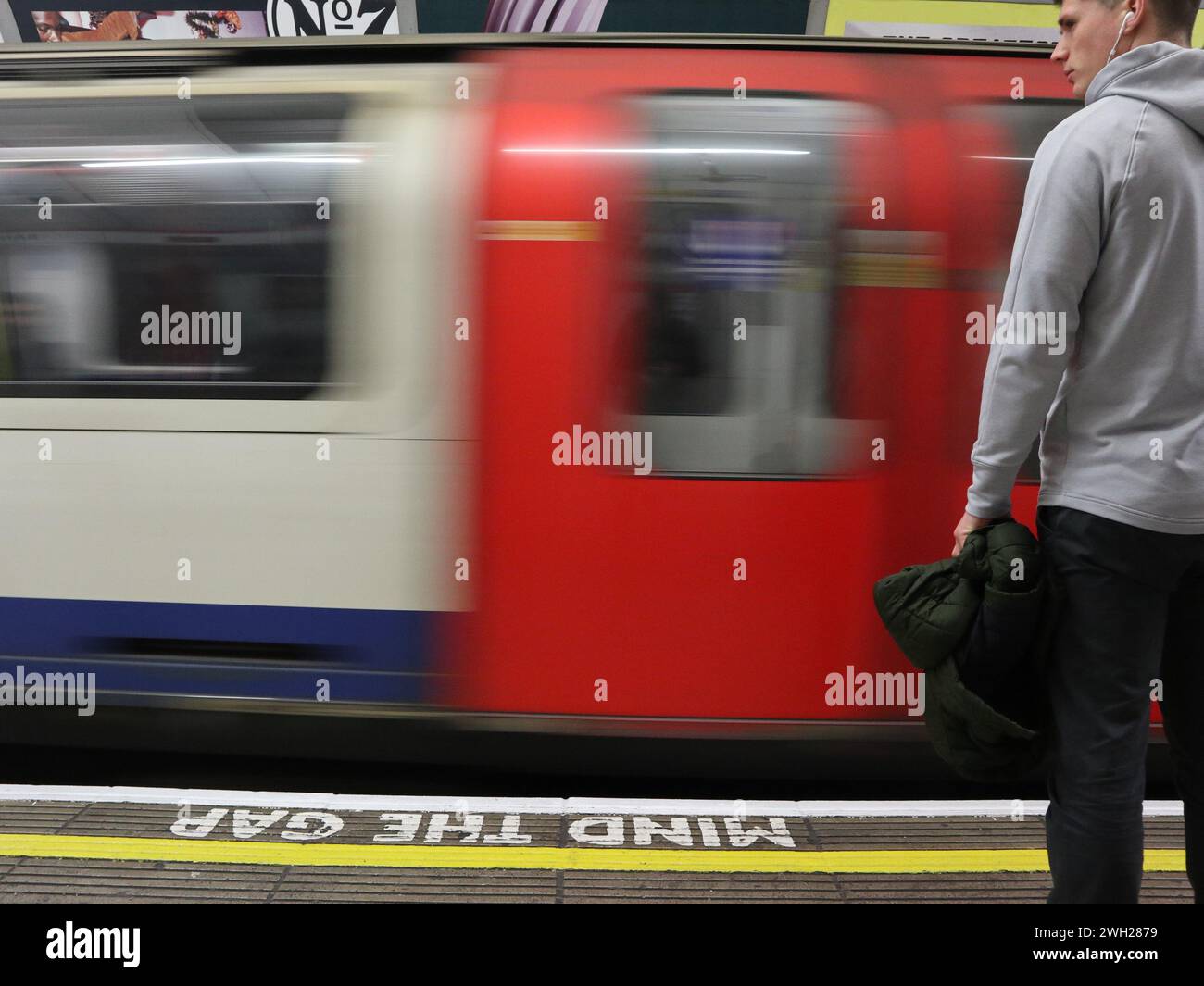 Man waiting London subway Stock Photo - Alamy