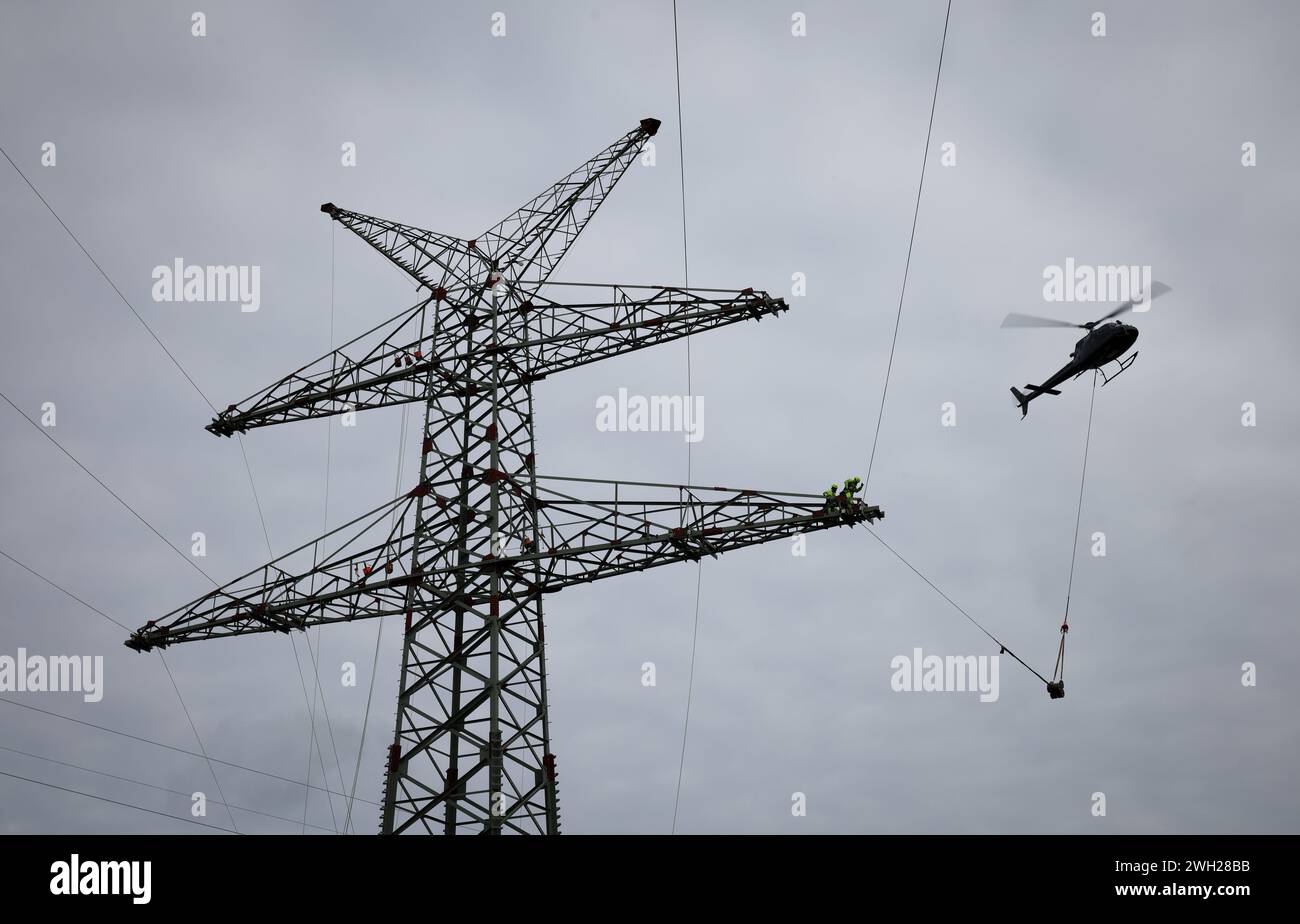 07 February 2024, Schleswig-Holstein, Pöhls: A helicopter flies between ...