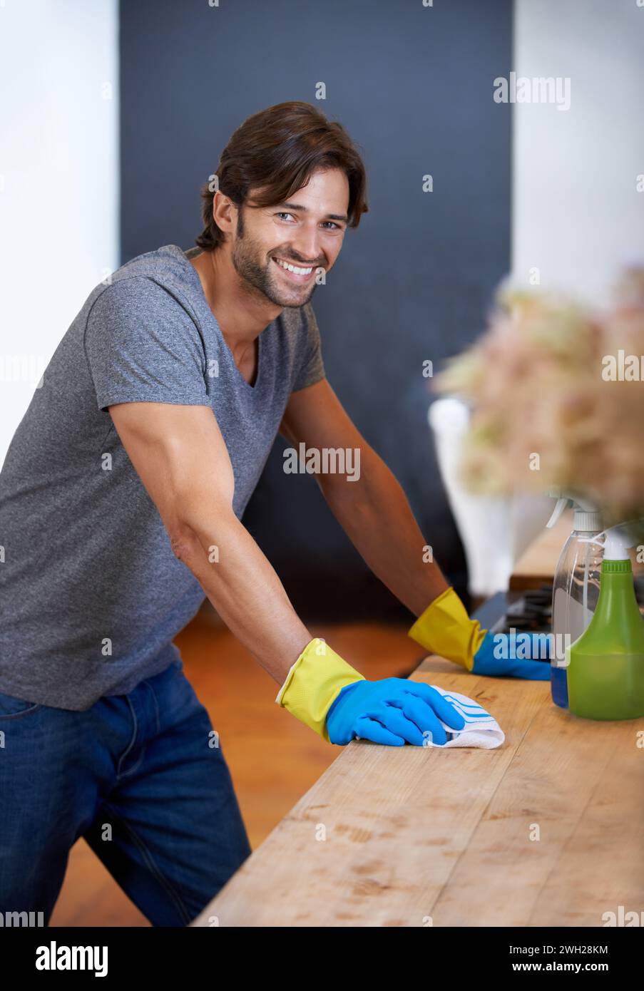 Happy man, portrait and cleaning table for housekeeping, hygiene or ...