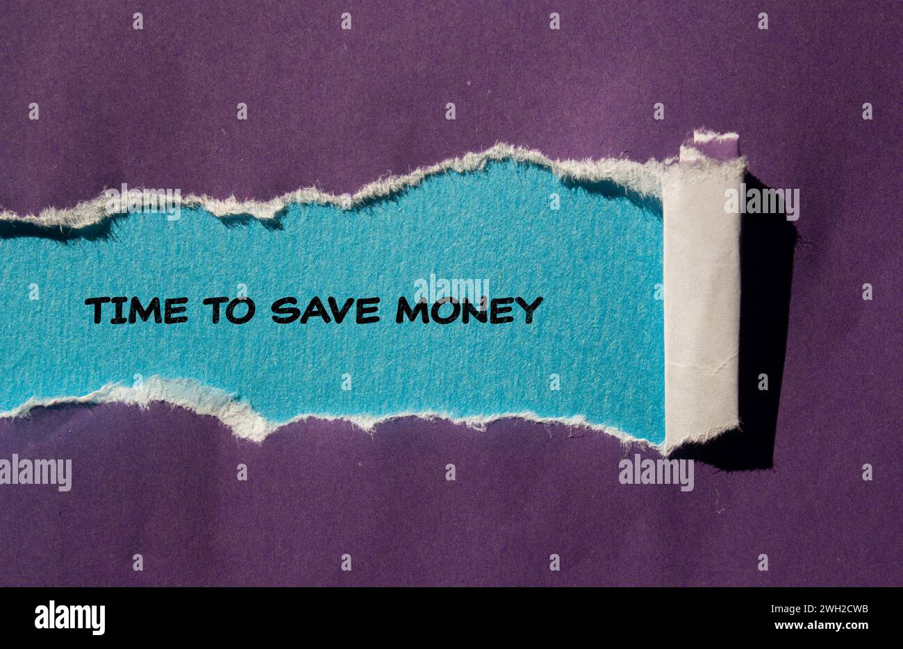 Time to save money lettering on ripped purple paper with blue ...