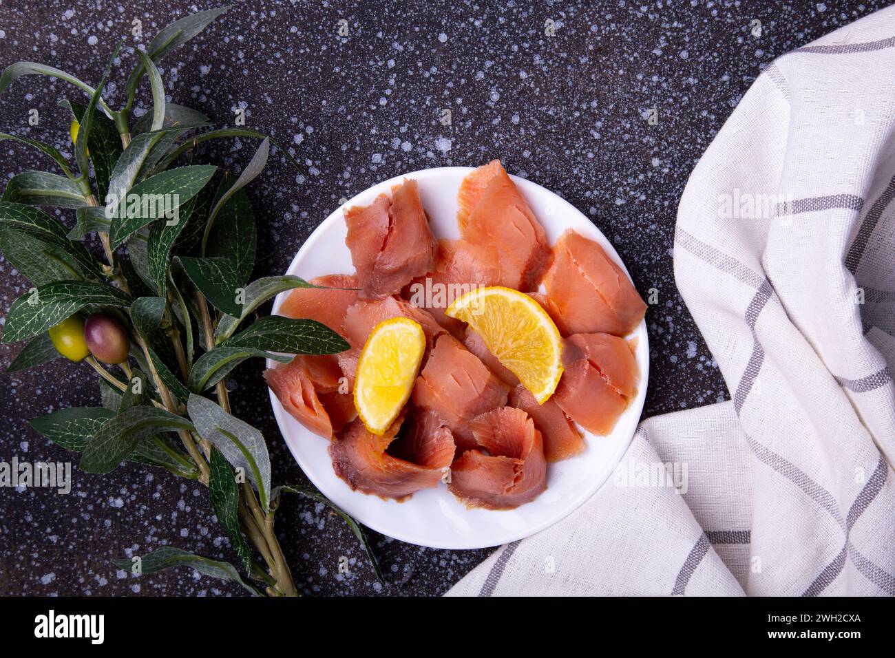 Elegant Smoked Salmon Platter with Fresh Lemon Garnish Stock Photo - Alamy