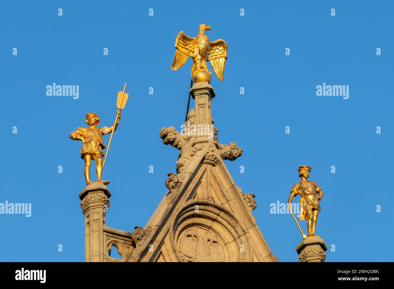 The beautiful golden statues on the roof of s historical building in ...