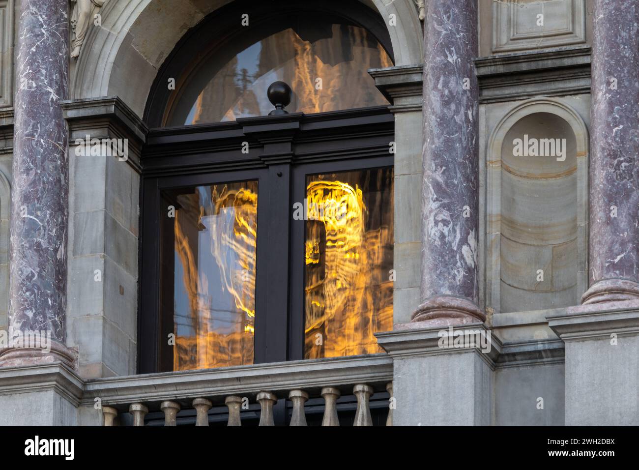 The reflection of a grand clock on window glass. Antwerp, Belgium Stock ...