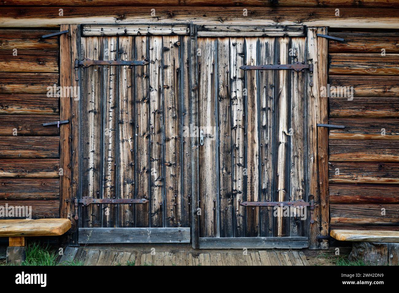 Closed ancient wooden gate of old farm house with handle. Beautiful ...