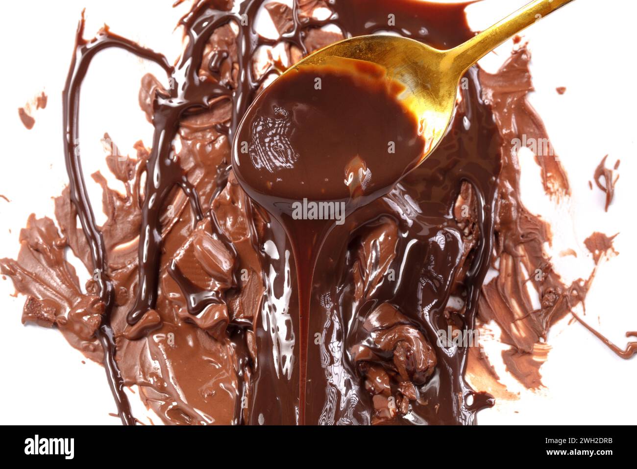 Sweet melted chocolate background with golden spoon.Mass of chocolate ...