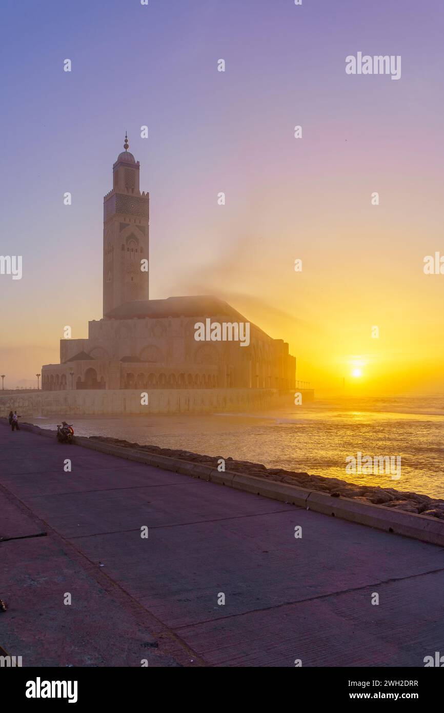 Sunset view of the Hassan II Mosque, with the promenade and El Hank ...