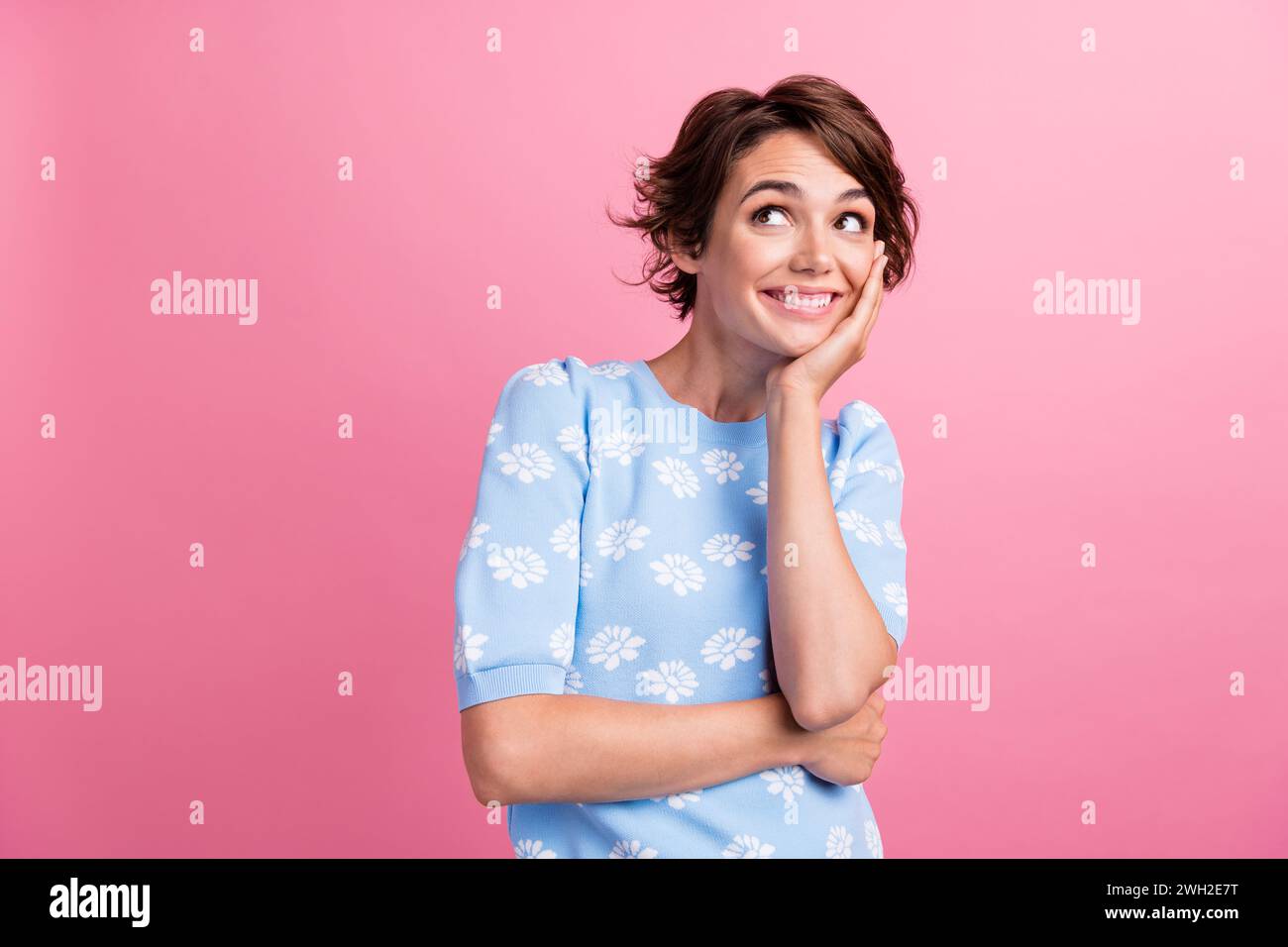 Portrait of cute cheerful creative person arm touch cheek look ...