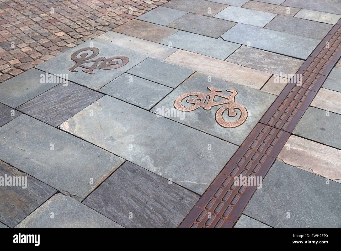 Stone paved bicycle path in Jonkoping, Sweden. Surface in old town made ...