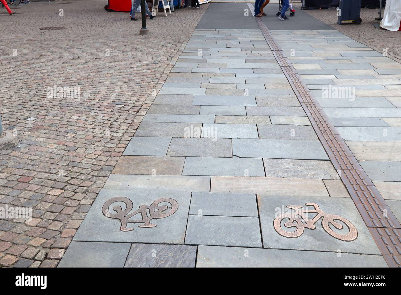 Stone paved bicycle path in Jonkoping, Sweden. Surface in old town made ...