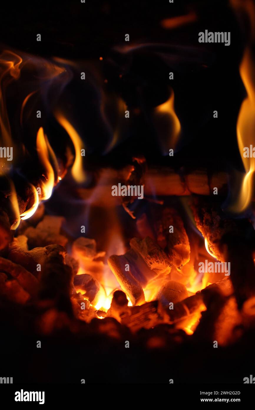 Yellow bright bonfire on black background, horizontal view. Orange ...