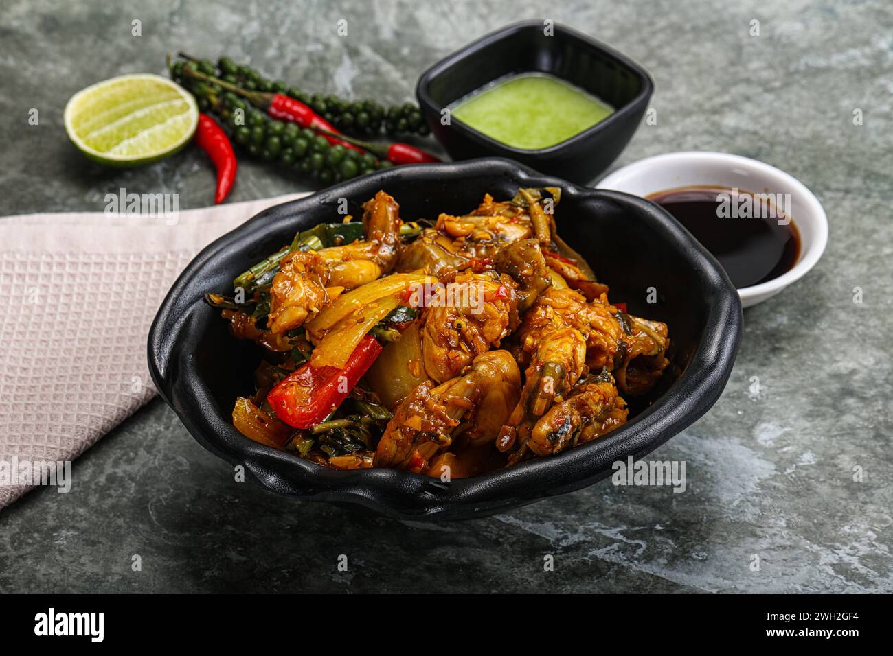 Vietnamese cuisine - fried frog with vegetables and spices Stock Photo ...