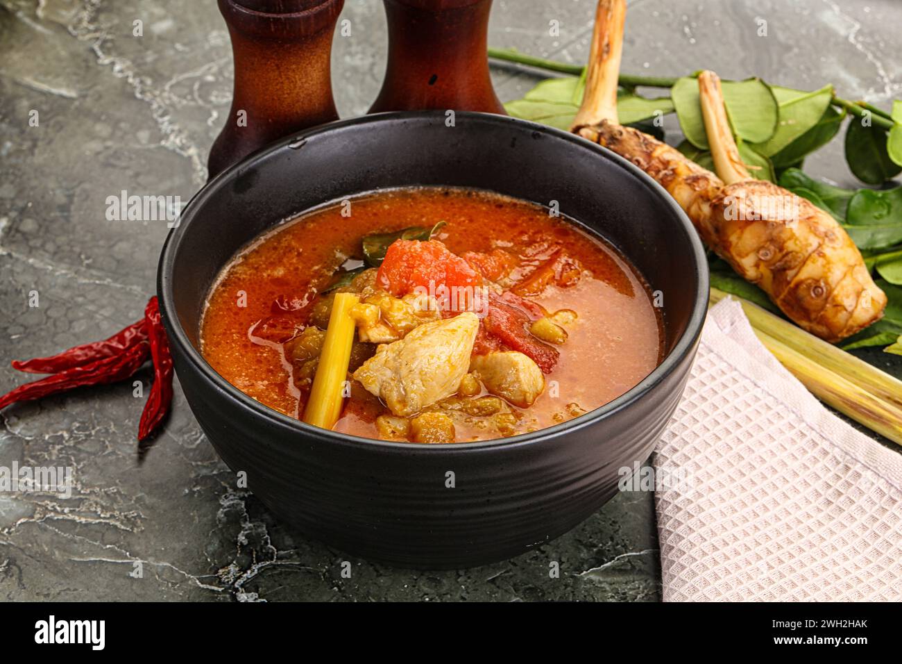 Thai traditional Tom Yum spicy soup with chicken Stock Photo - Alamy