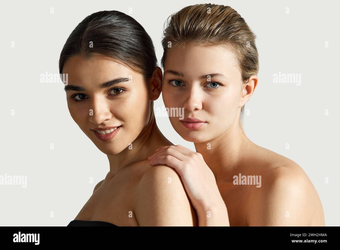Portrait of two beautiful girls with natural makeup, perfect, well-kept ...
