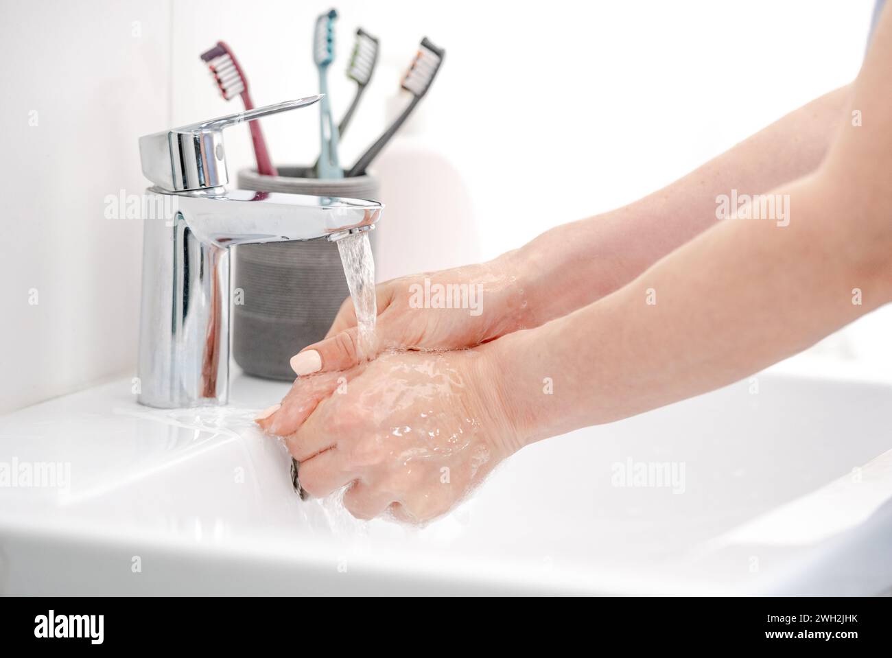 Hand washing rinsing off hi-res stock photography and images - Alamy