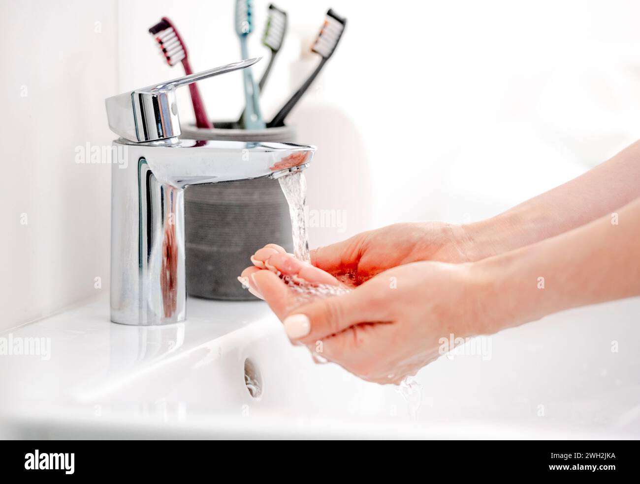 Female Hands Under A Faucet Fill Water Into Palms For Morning Hygiene ...