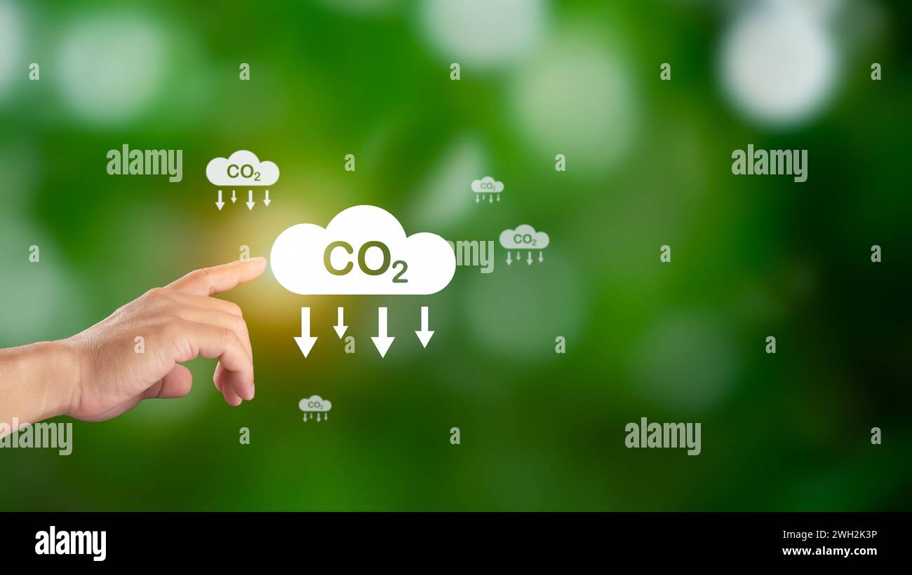 Hand holding CO2 reducing icon for decrease carbon dioxide emission ...