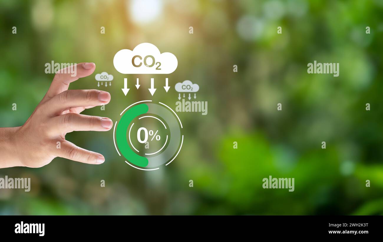 Hand holding CO2 reducing icon for decrease carbon dioxide emission ...