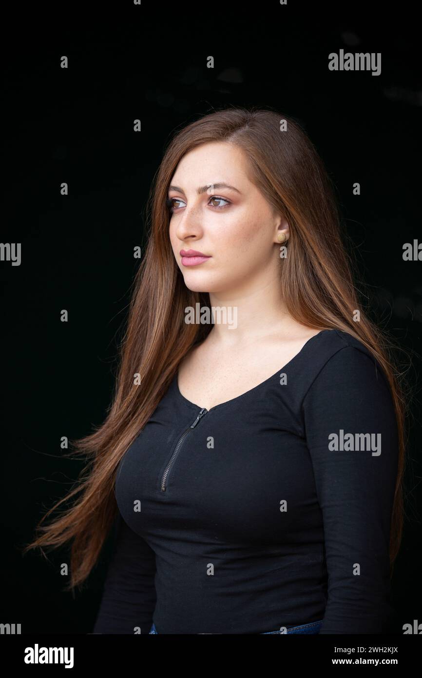 Beautiful young woman looking away Stock Photo - Alamy