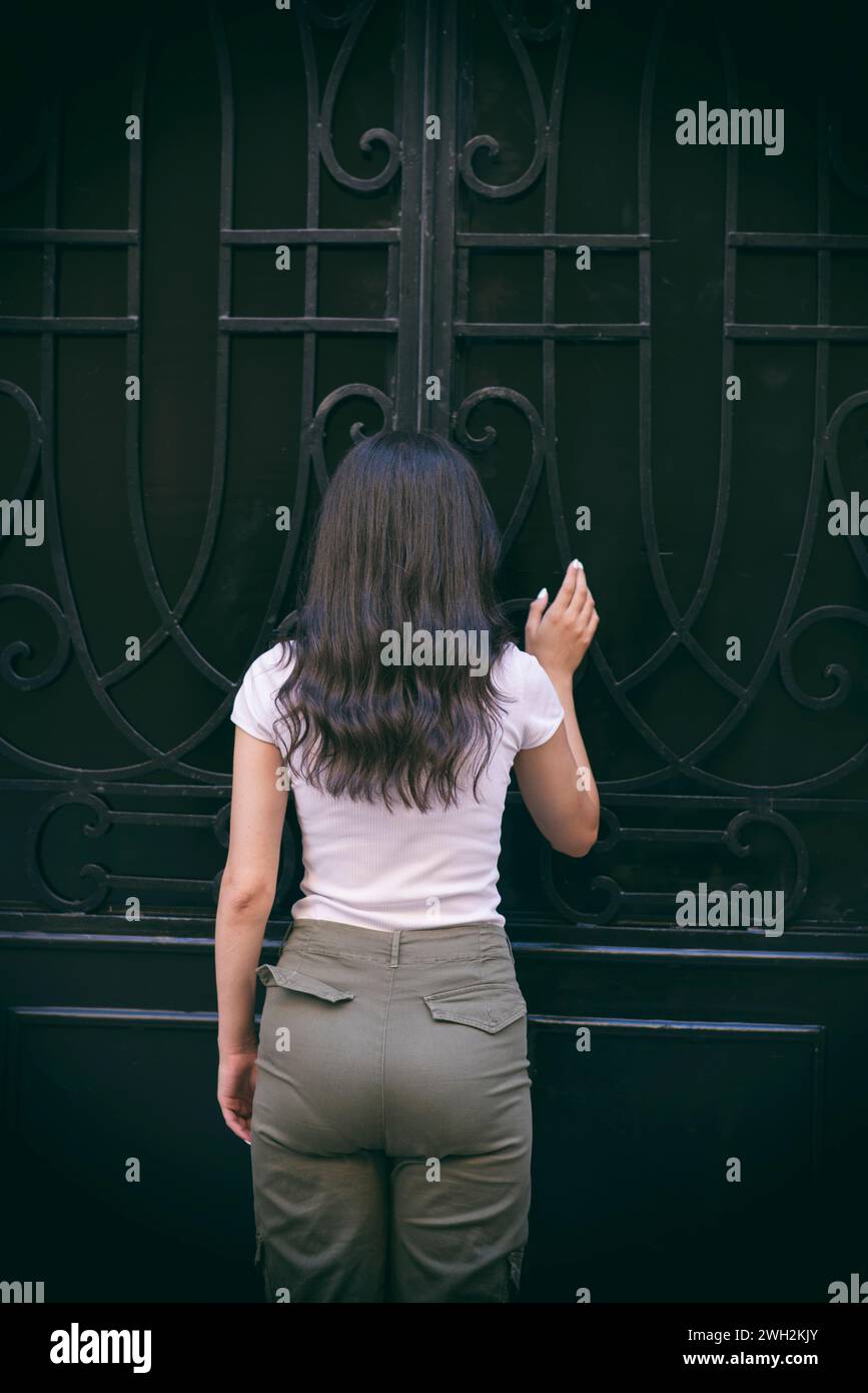 Woman and gate and alone hi-res stock photography and images - Alamy