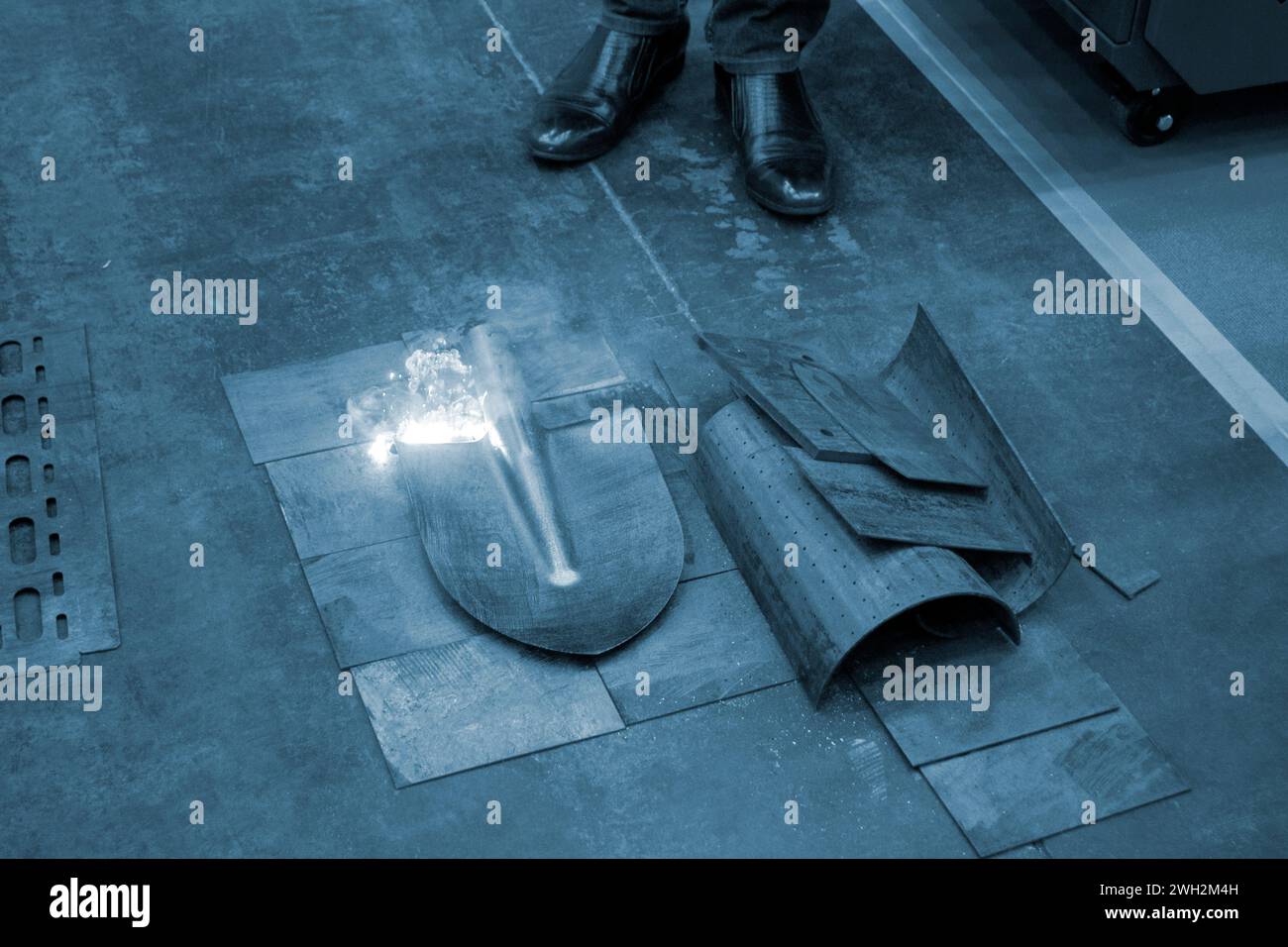 Laser cleaning of metal. The laser beam cleans the metal surface from ...