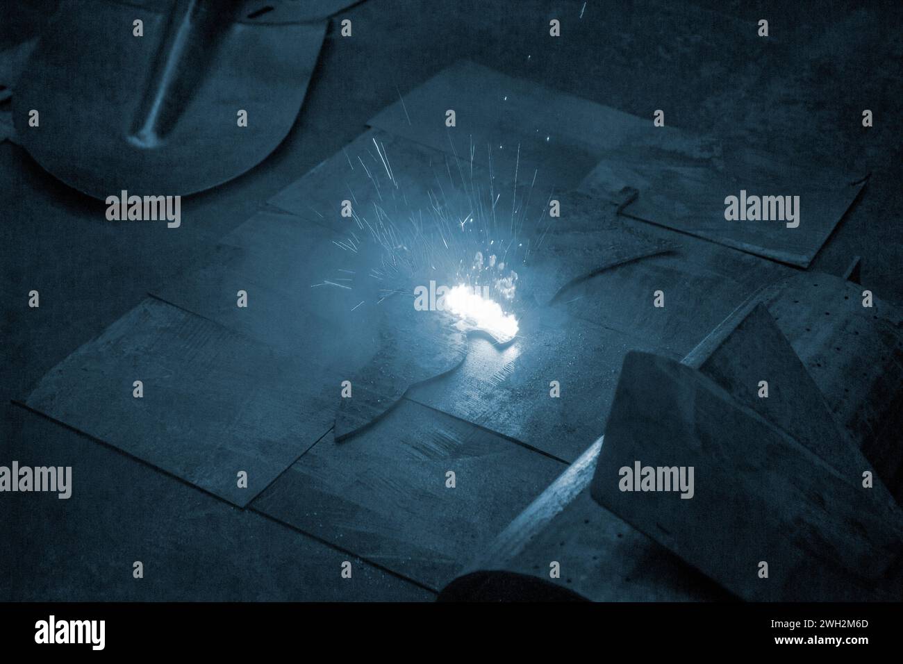 Laser cleaning of metal. The laser beam cleans the metal surface from ...