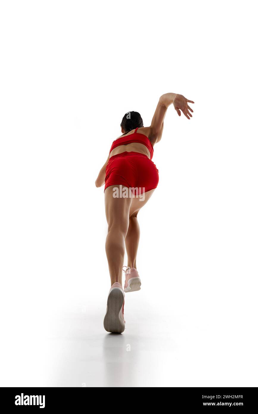 Dynamic image of competitive woman, runner in motion, training, running ...