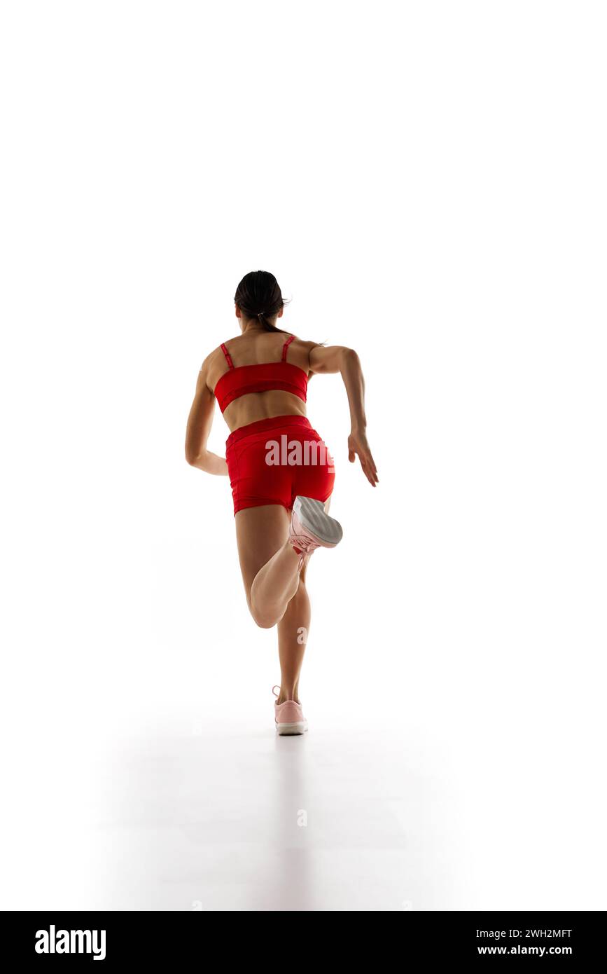 Dynamic image of competitive woman, runner in motion, training, running ...