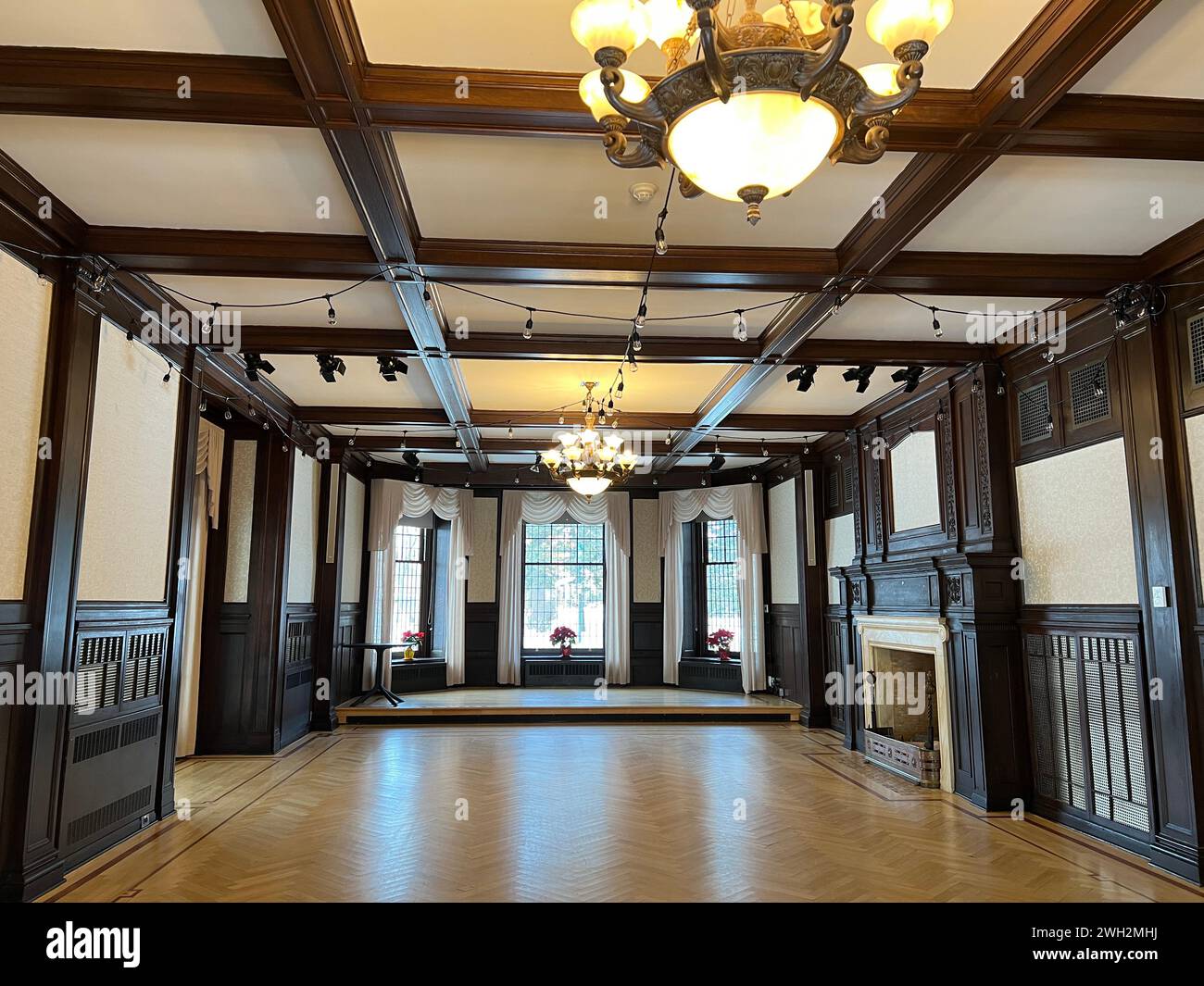 Entering the empty ballroom with wooden floors and chandeliers Stock ...