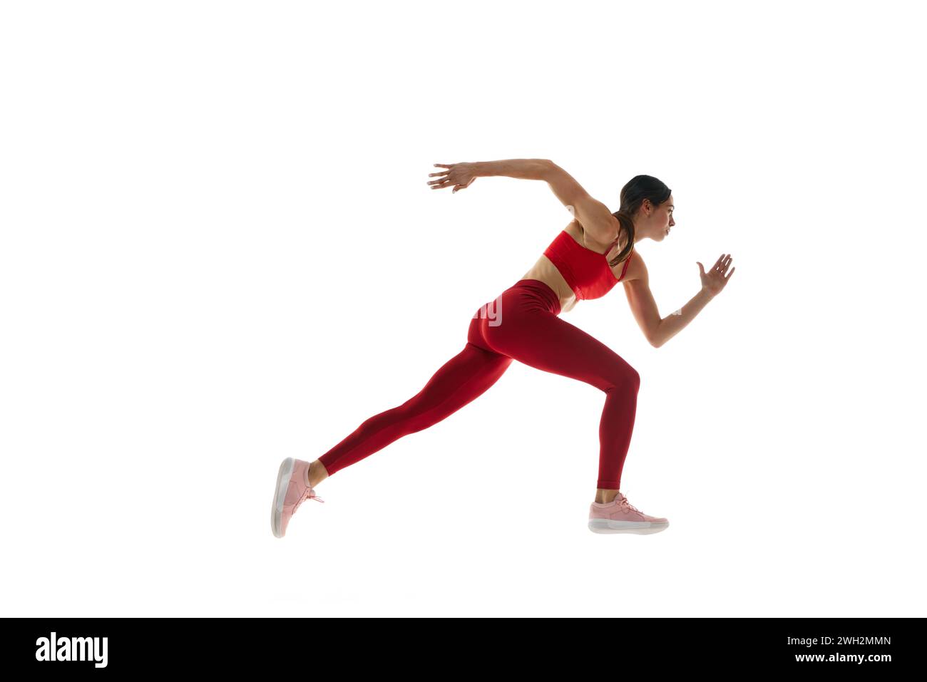 Side view. Athletics. Motivated woman in motion, running, training ...