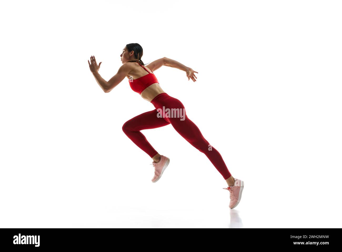 Competitive, concentrated young woman, runner athlete training, running ...