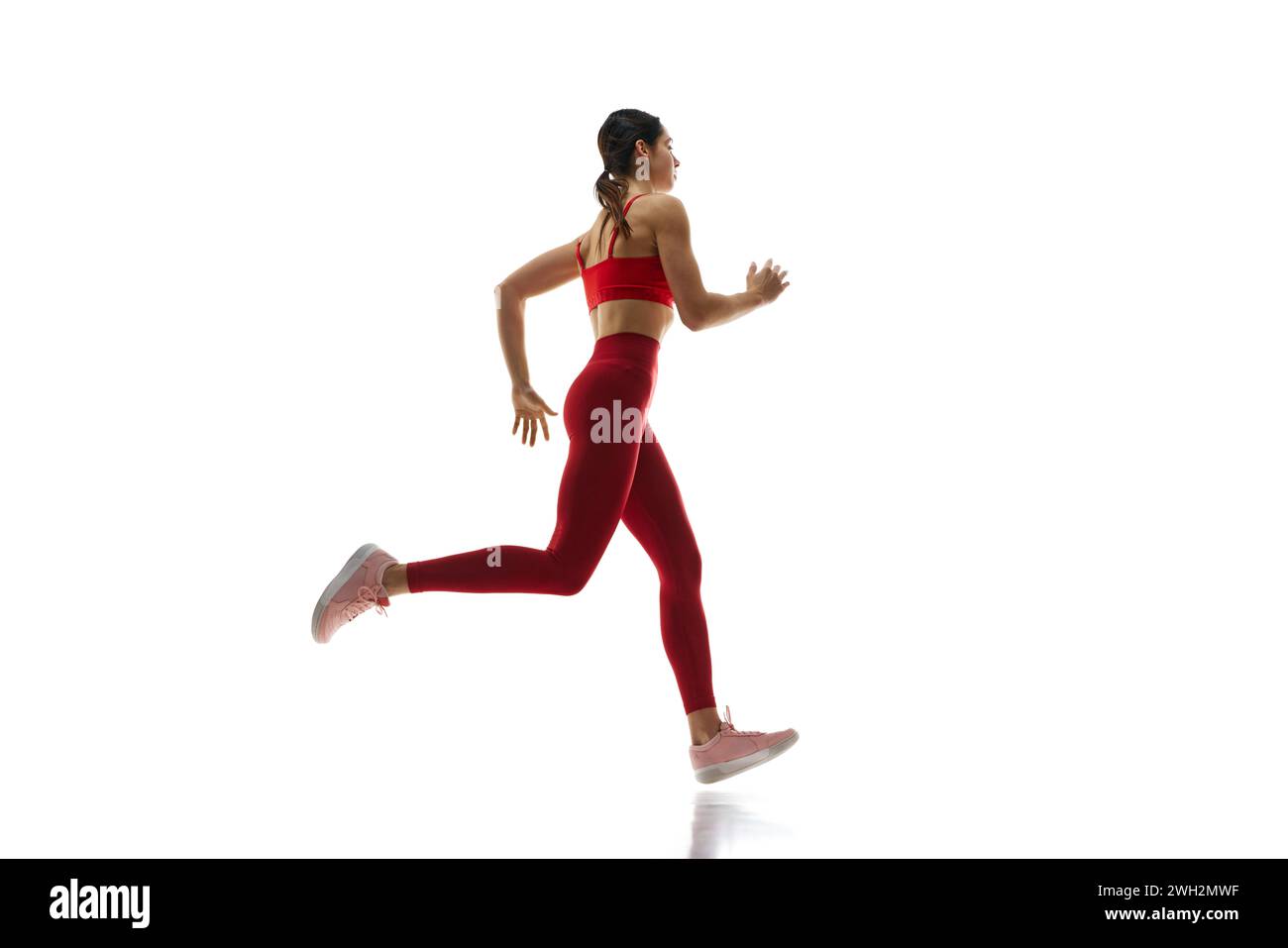 Dynamics, endurance and energy. Female runner athlete in motion ...