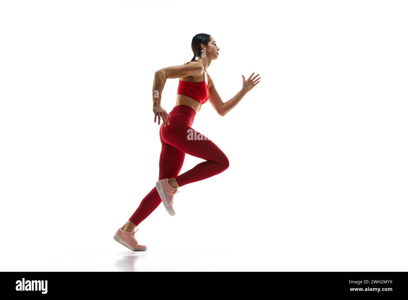 Dynamics, endurance and energy. Female runner athlete in motion ...