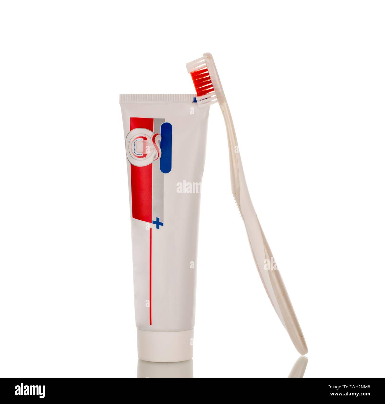 One toothbrush with tube of toothpaste, macro, isolated on white ...