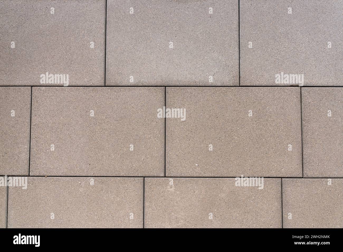 Pattern of grey rectangular paving slabs with dark gaps in between for ...
