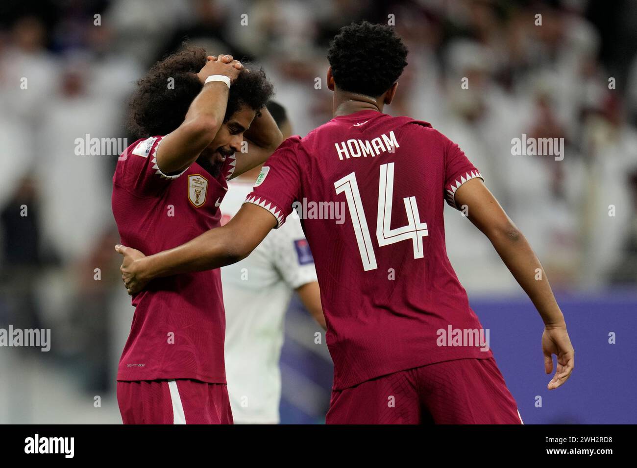 Qatar's Akram Afif, left, reacts during the Asian Cup semifinal soccer ...