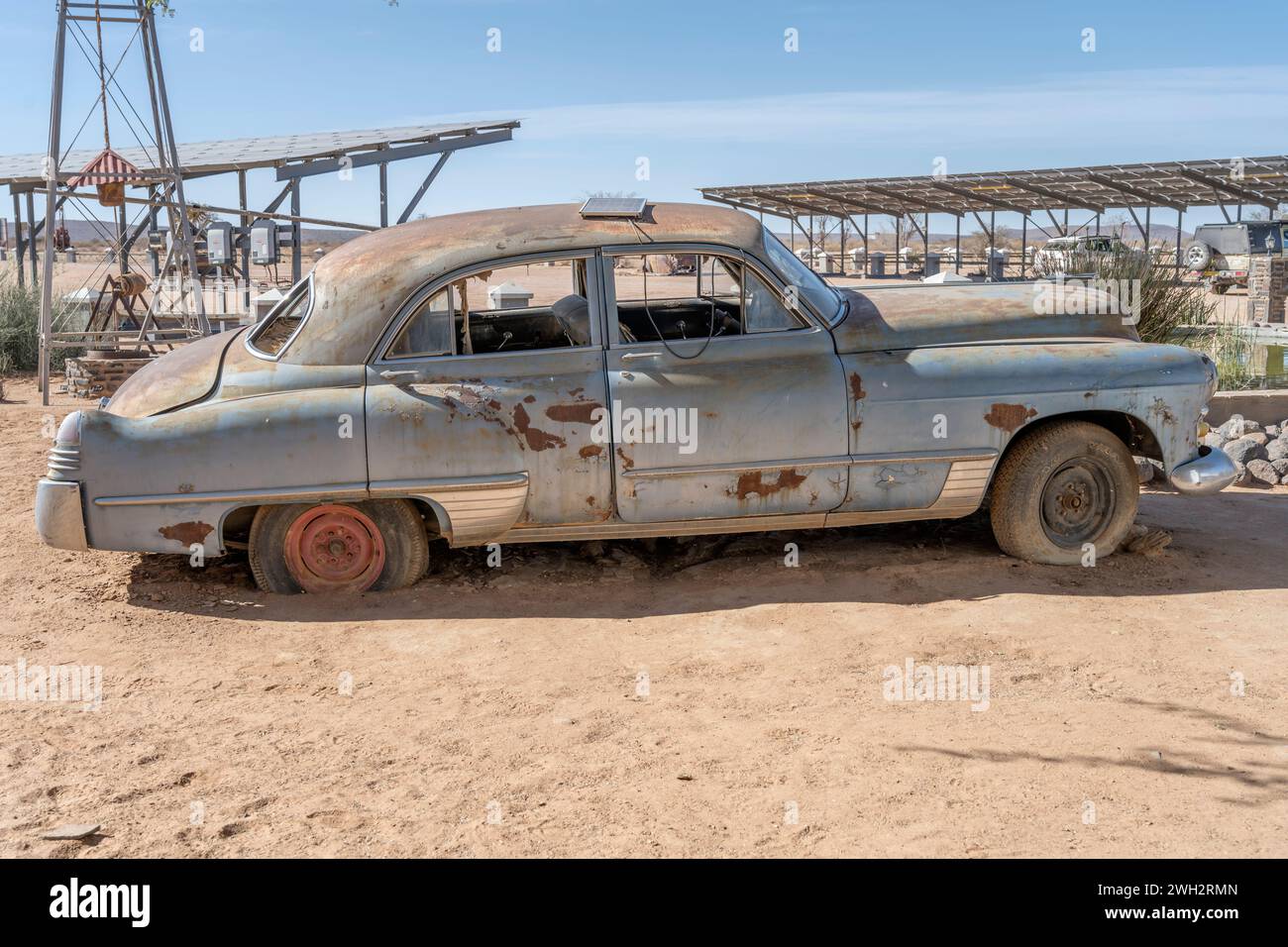 vintage 40's large saloon-car worn down by rust in exibition at fuel ...