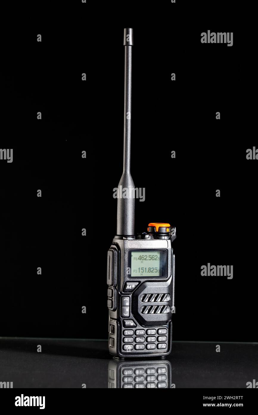 Walkie-talkie - VHF/UHF two-way radio with antenna on the black ...