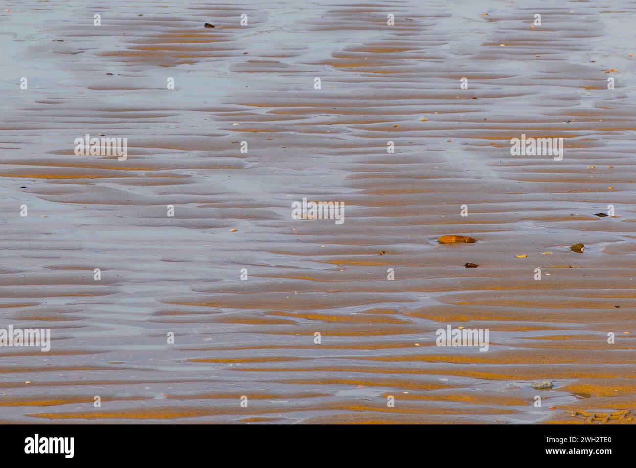 Water on rippled sand on a beach - texture, pattern Stock Photo - Alamy