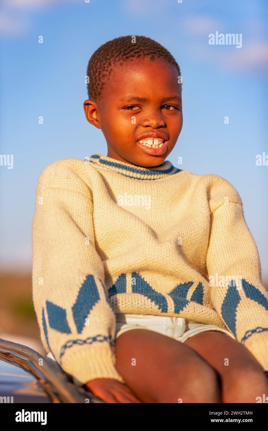 village african child standing outdoors against the blue sky Stock ...