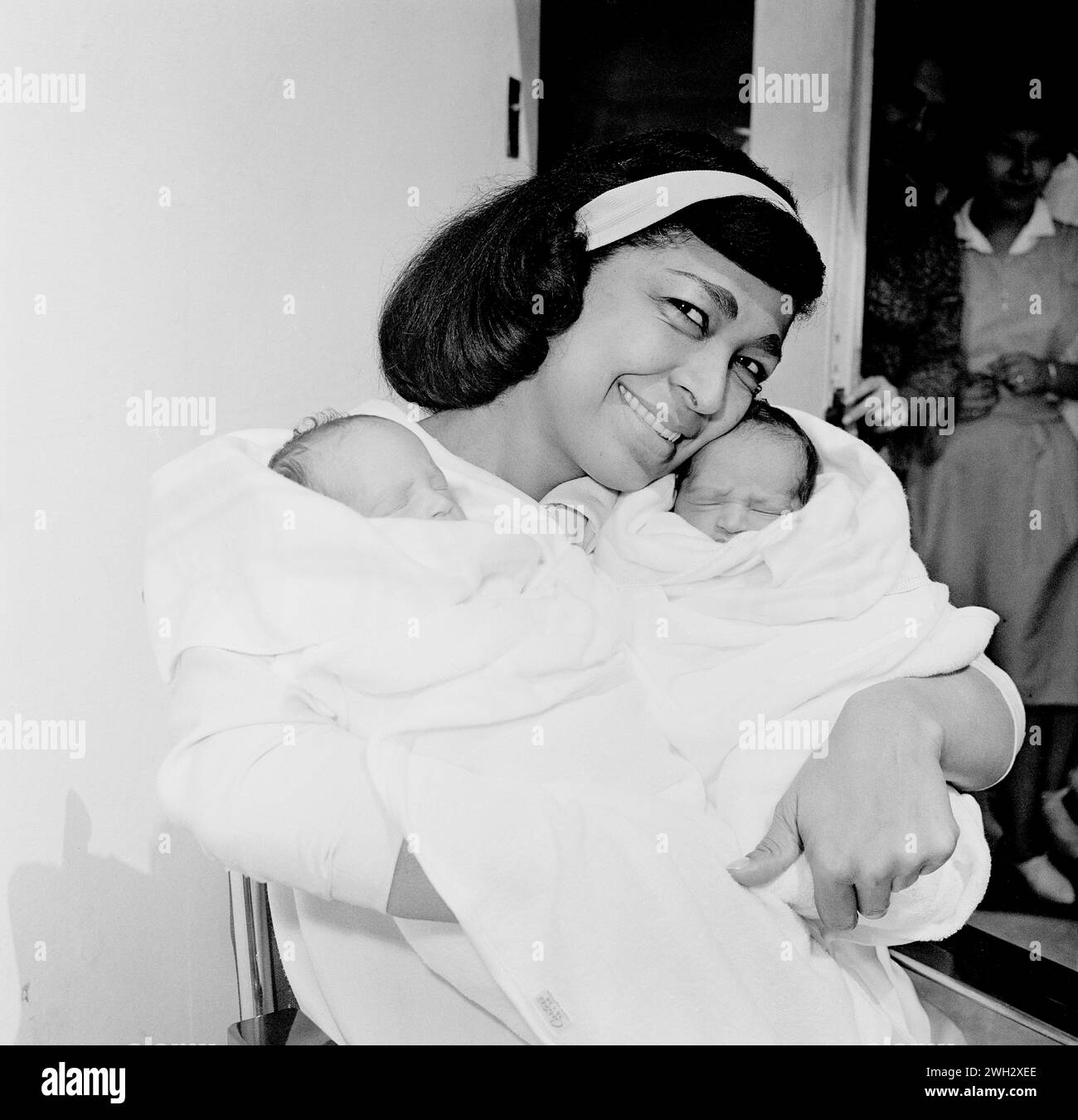 Mrs. Maria Cole, wife of singer Nat (King) Cole, has a big smile for ...