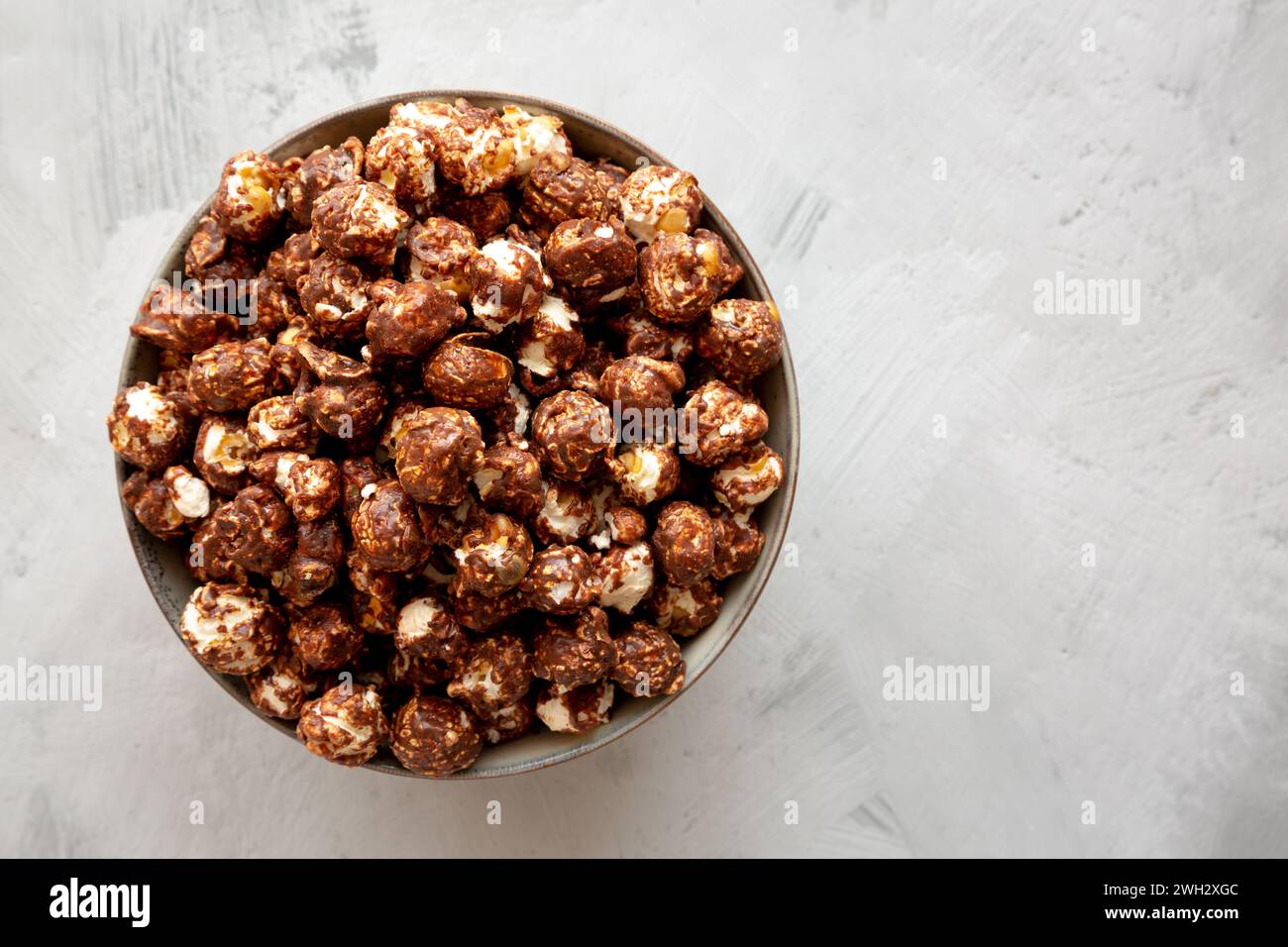 Homemade Chocolate Caramel Popcorn in a Bowl, top view. Flat lay ...