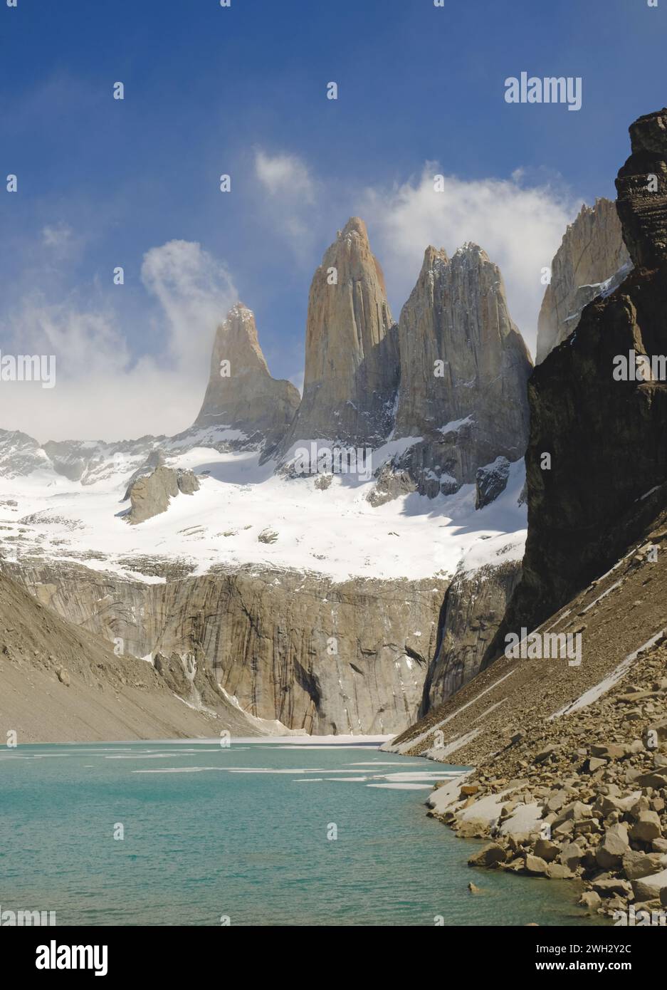 Torres del Paine, viewed from the lake at the foot of the peaks, known ...