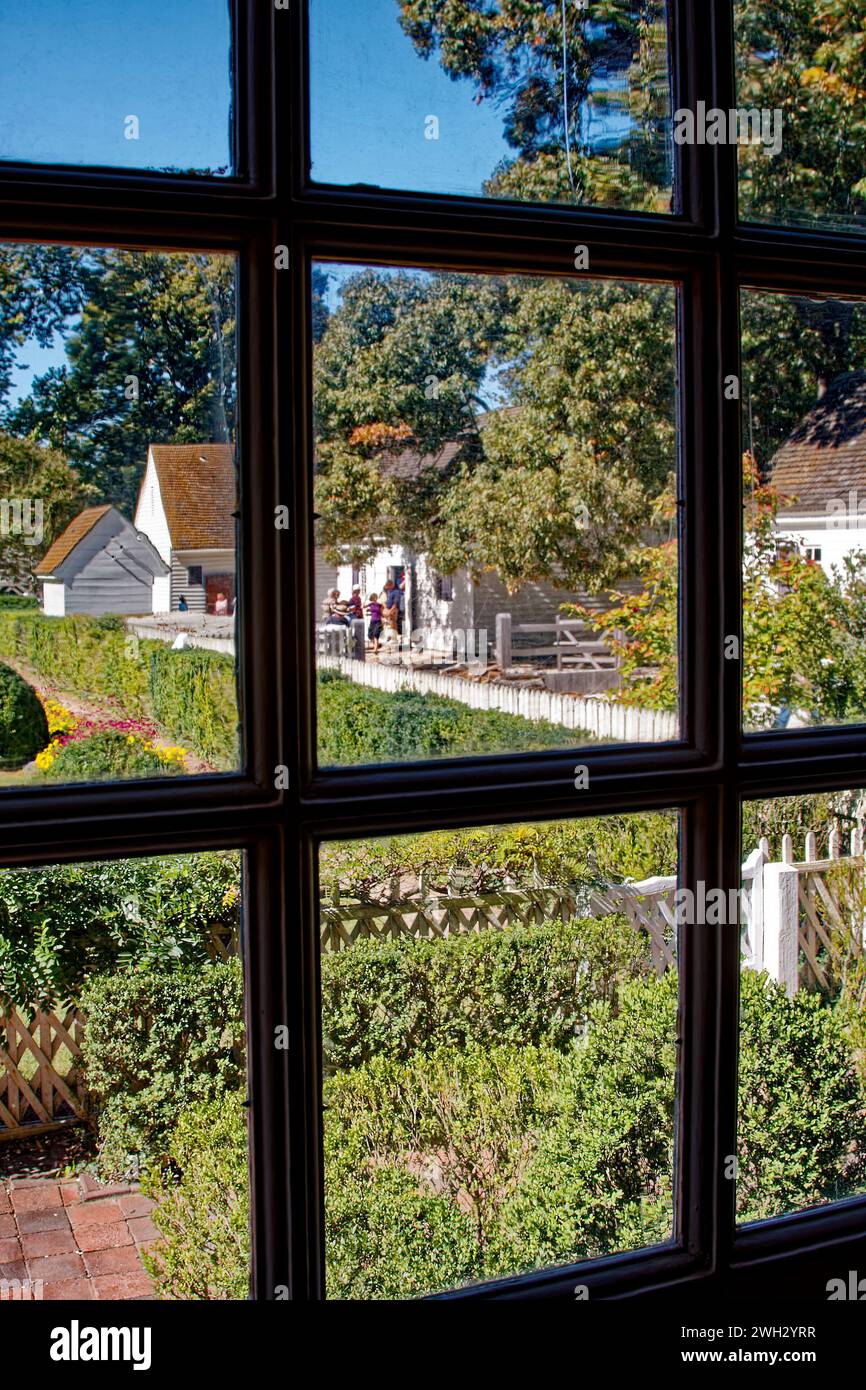 garden seen through window, 9 panes, old glass, white buildings, people, autumn, Colonial ...