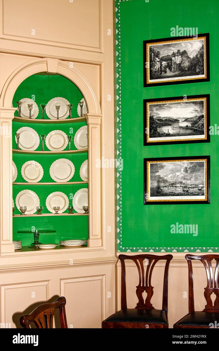 dining room, alcove for dishes, 3 pictures hanging, chairs, bright ...