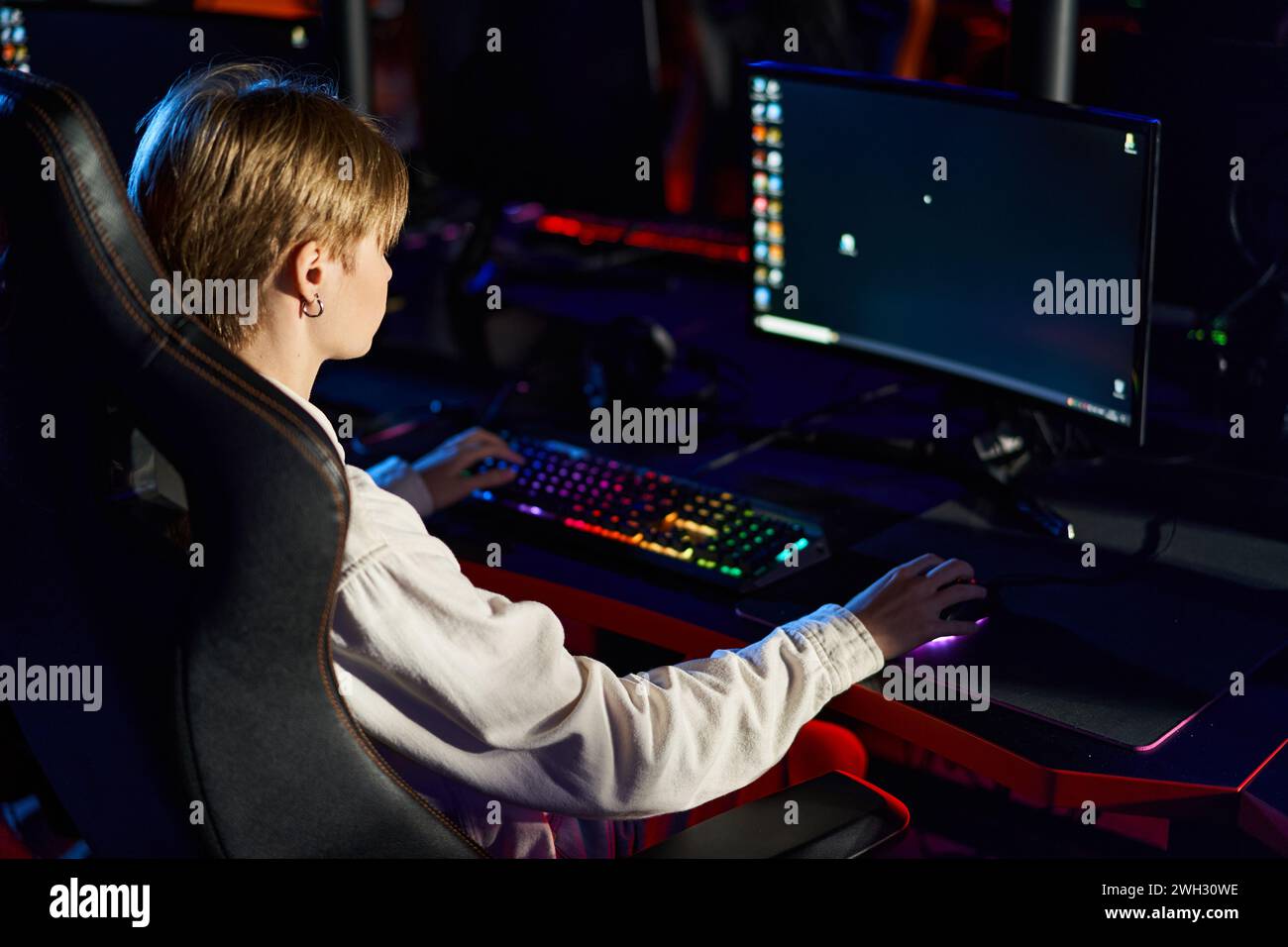 gamer playing cybersport games on a computer with a vivid screen ...