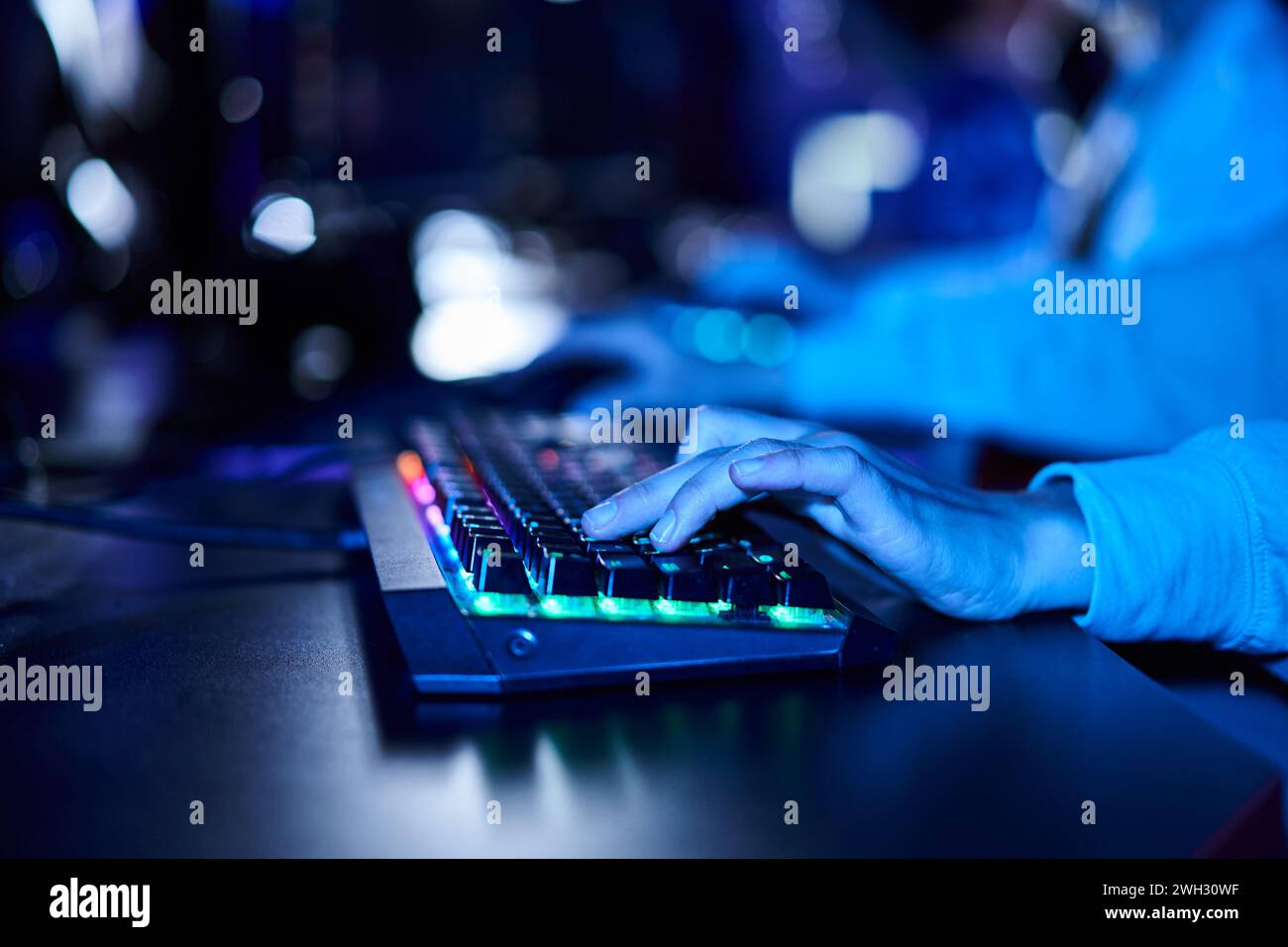 focus on cropped female hands typing on computer keyboard with ...